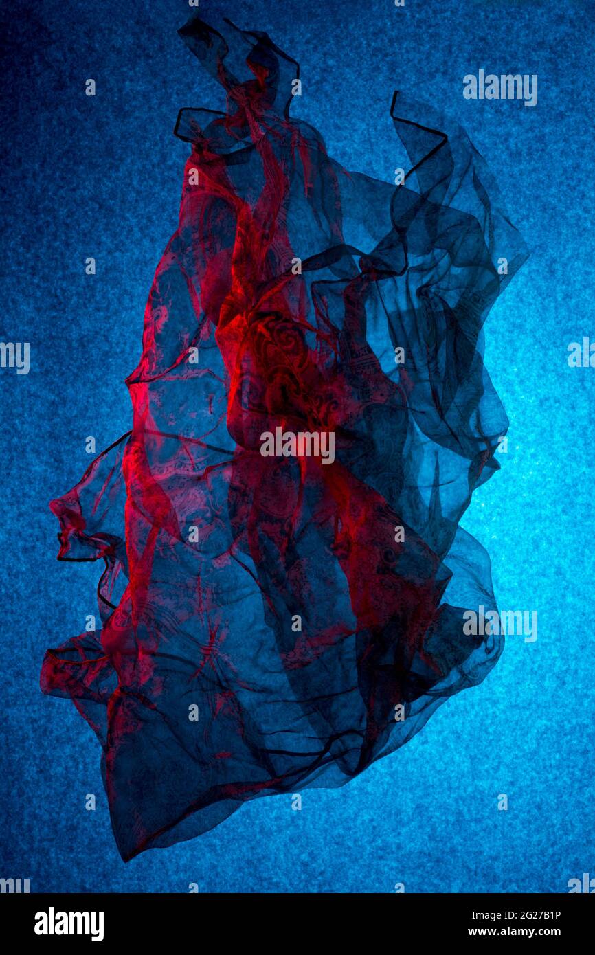 Transparent thin handkerchief on a blue background Stock Photo - Alamy