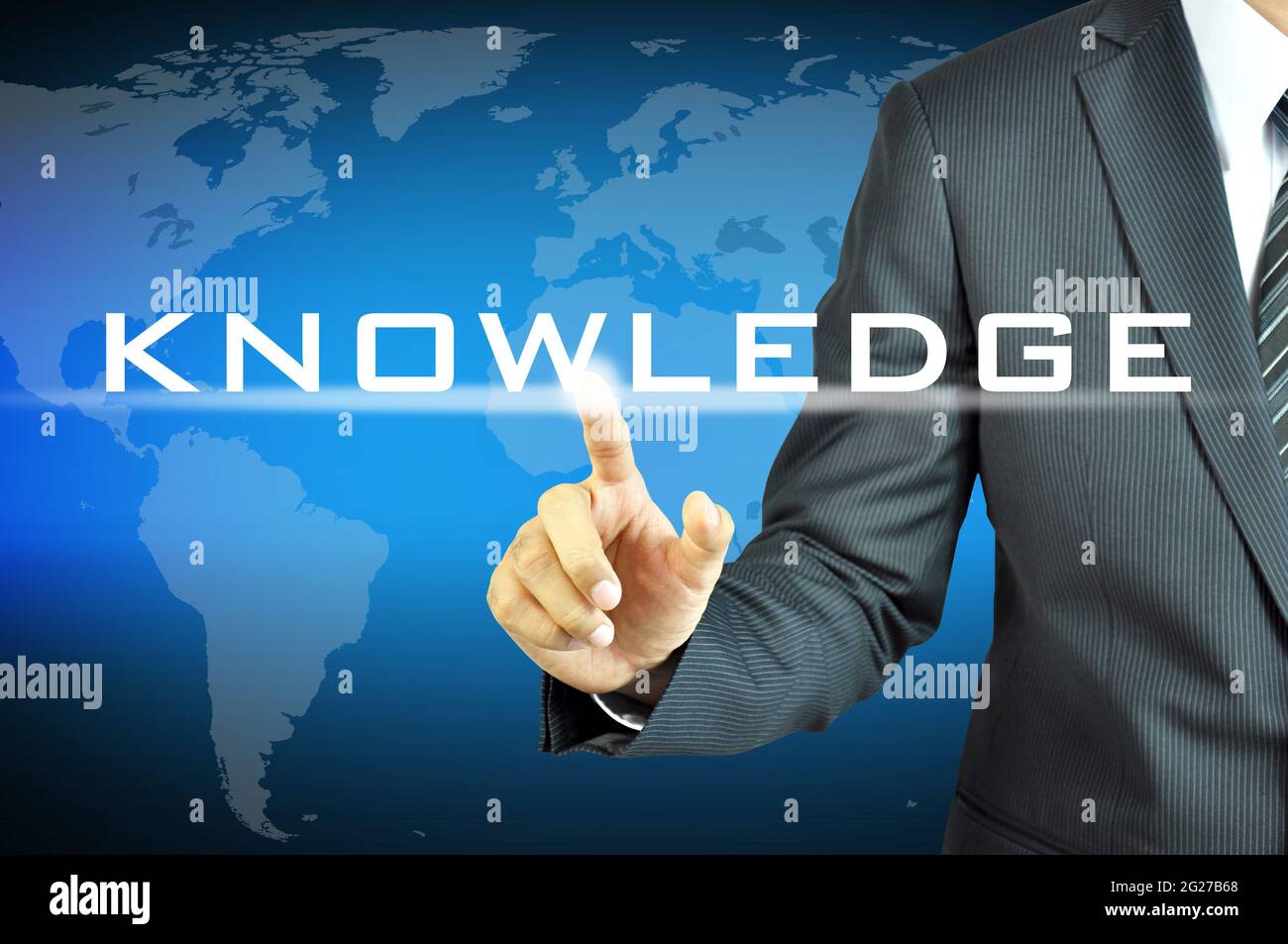 Businessman touching KNOWLEDGE sign on virtual screen Stock Photo - Alamy