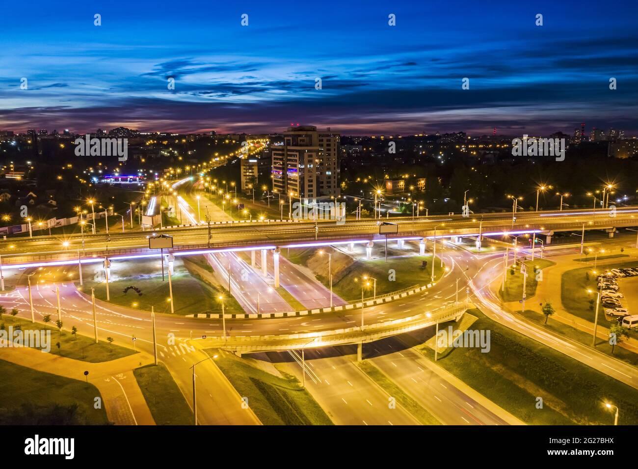 aerial drone photo of urban multilevel ring junction road in twilight ...