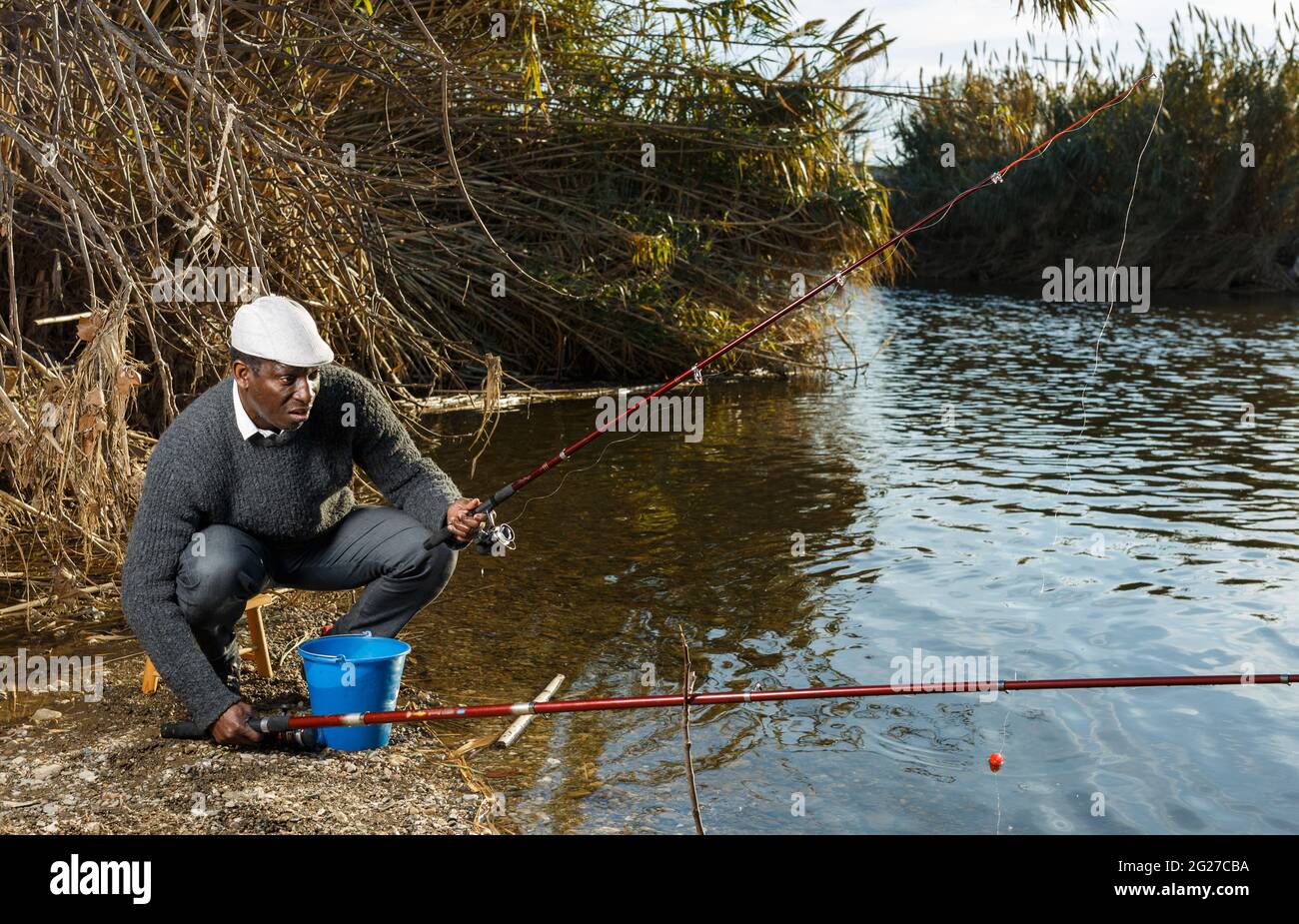 African fisherman bucket fish hi-res stock photography and images - Alamy
