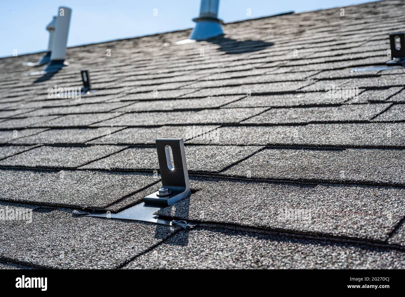 Residential asphalt shingle roof with metal anchors installed for the ...