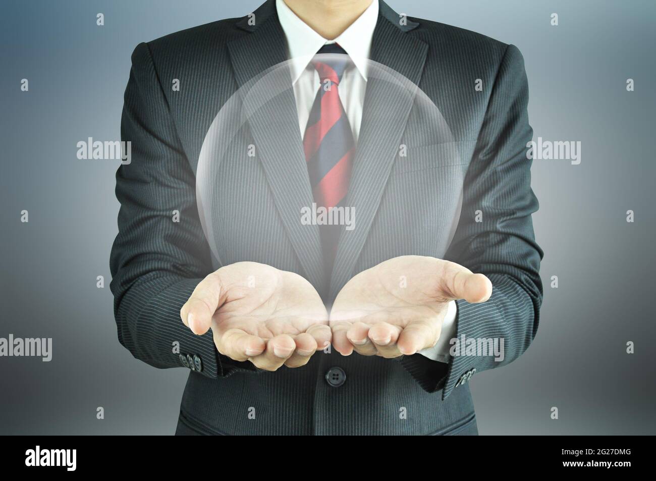 Empty transparent sphere over open hands of businessman Stock Photo - Alamy