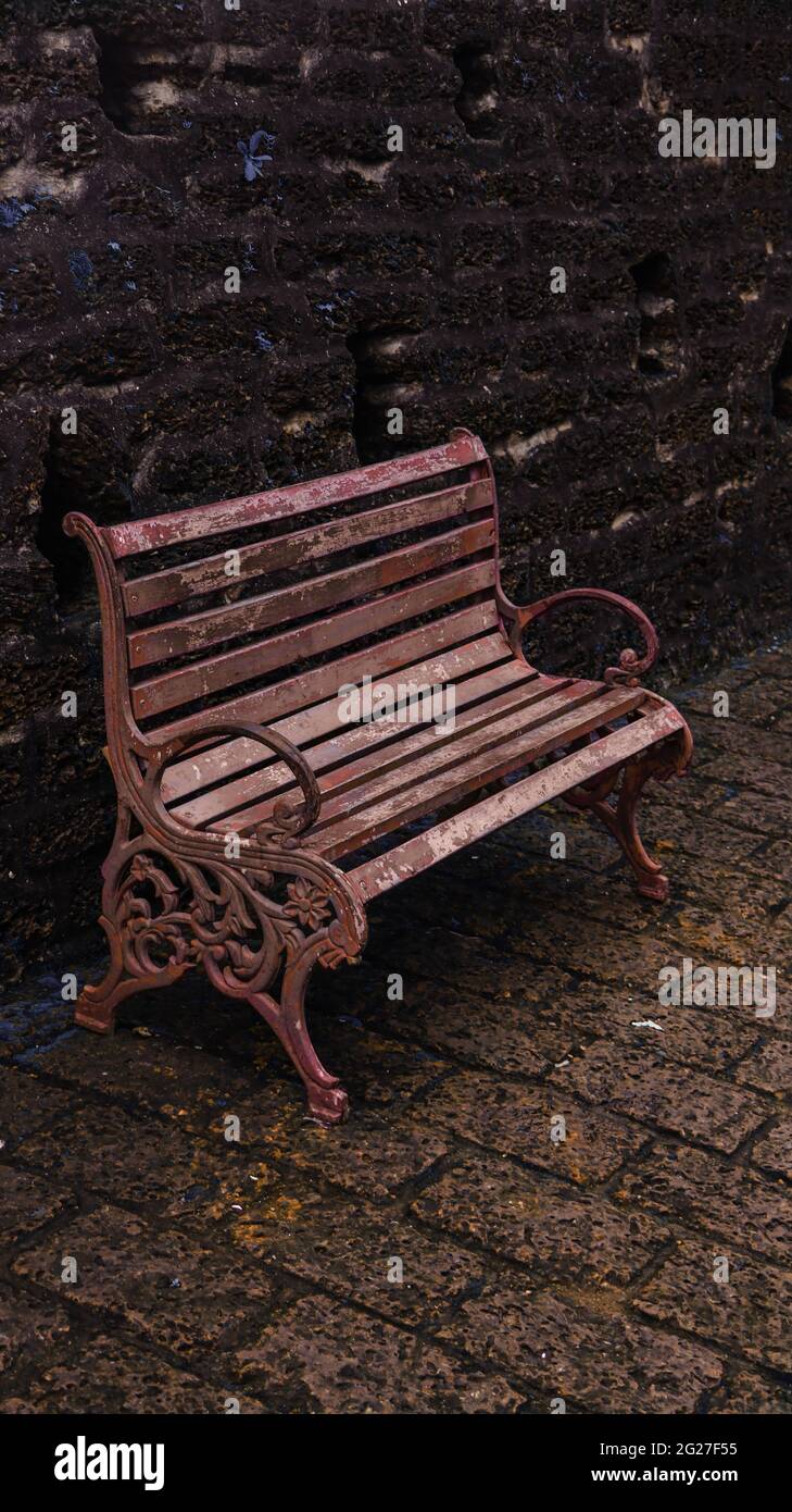 old vintage chair from olden times in a park for people to relax on ...