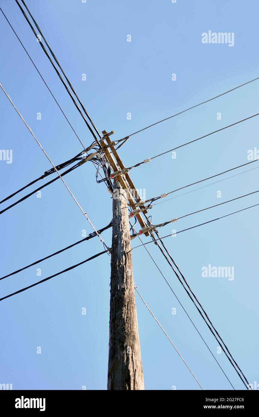 Old wooden electricity post with electrical wires Stock Photo - Alamy