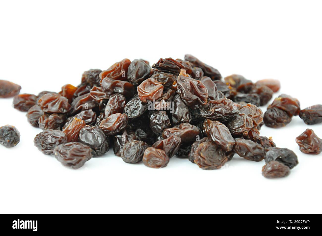 Heap of dark raisins on white background Stock Photo - Alamy