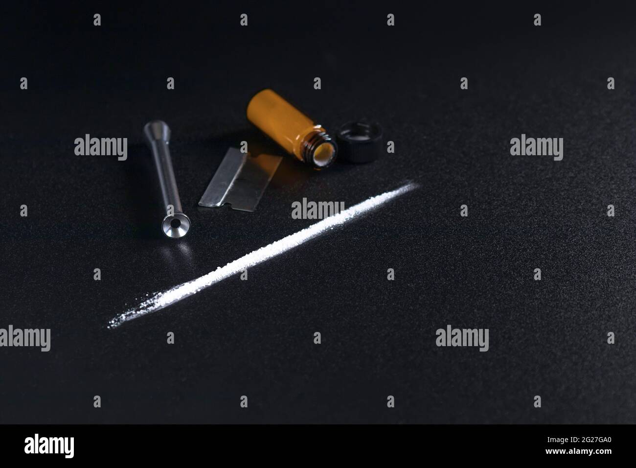 Cocaine on a Black Background, Cocaine Bottle Stock Photo - Alamy