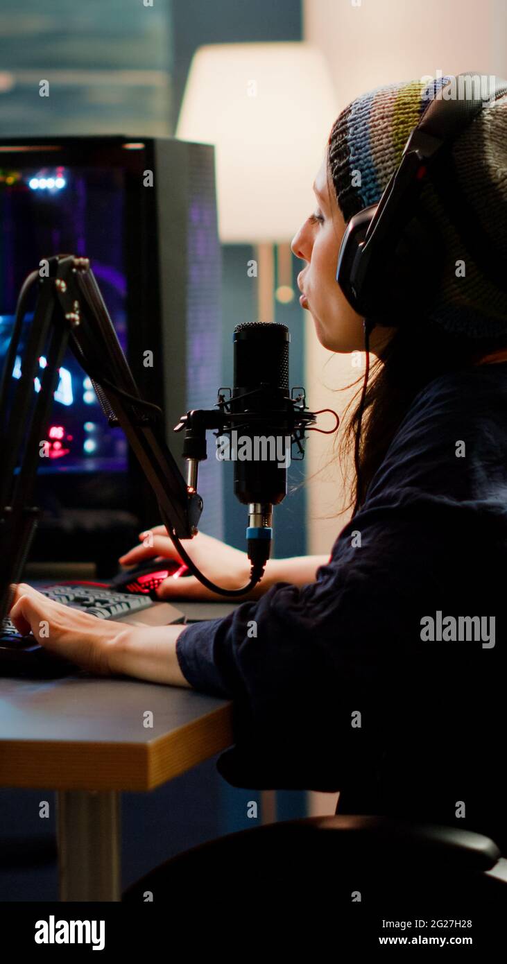 Streamer putting on headphone and start talking into microphone with ...