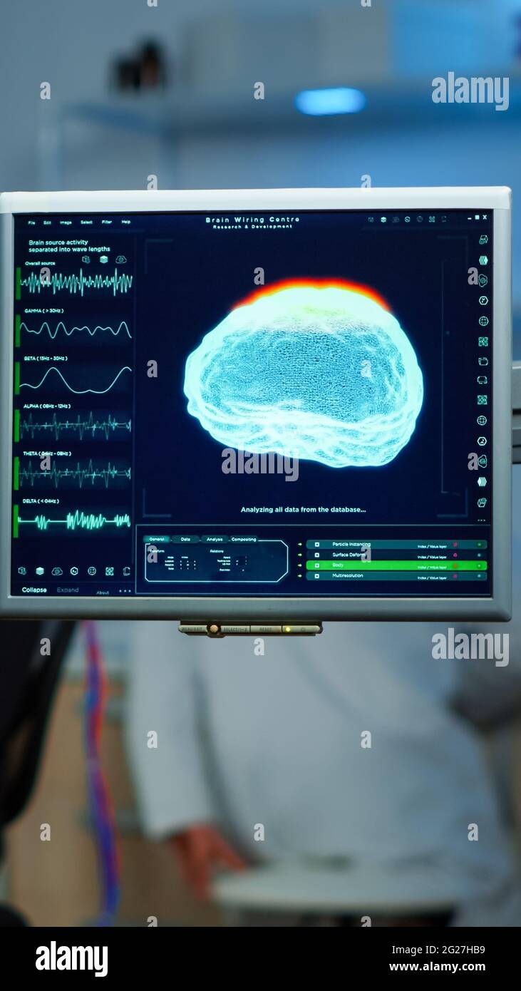 Neurologist doctor analysing nervous system using eeg headset scanning ...