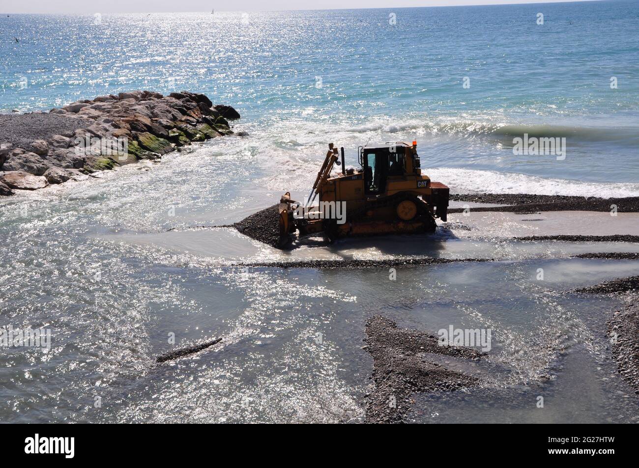 Work on the seaside with a loader in Nice Stock Photo - Alamy