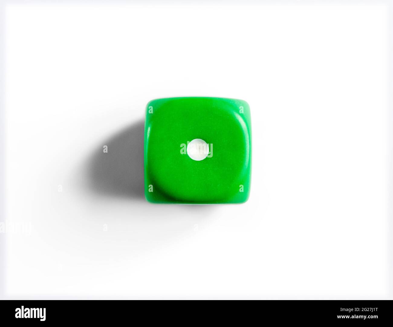 Number 1 on green dice. White background. Top view Stock Photo - Alamy