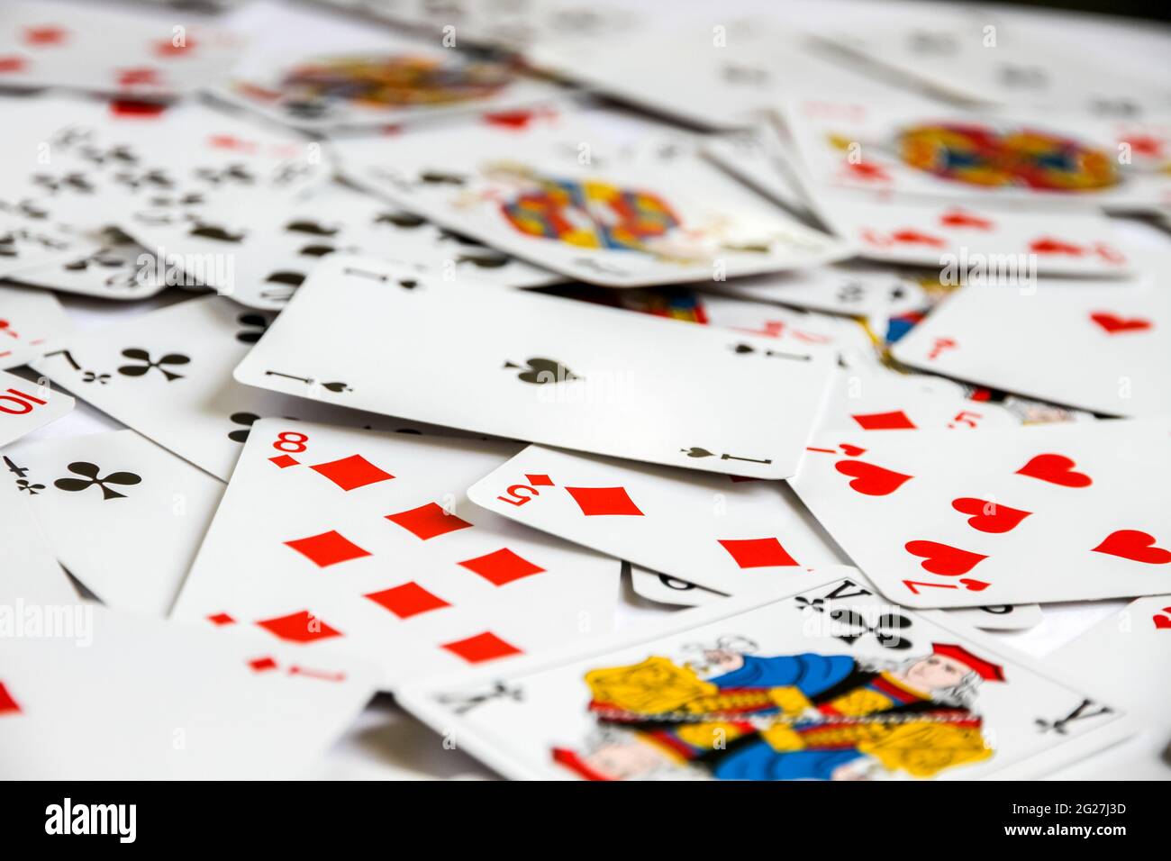 Classic playing card game laid out on a table. White background Stock ...
