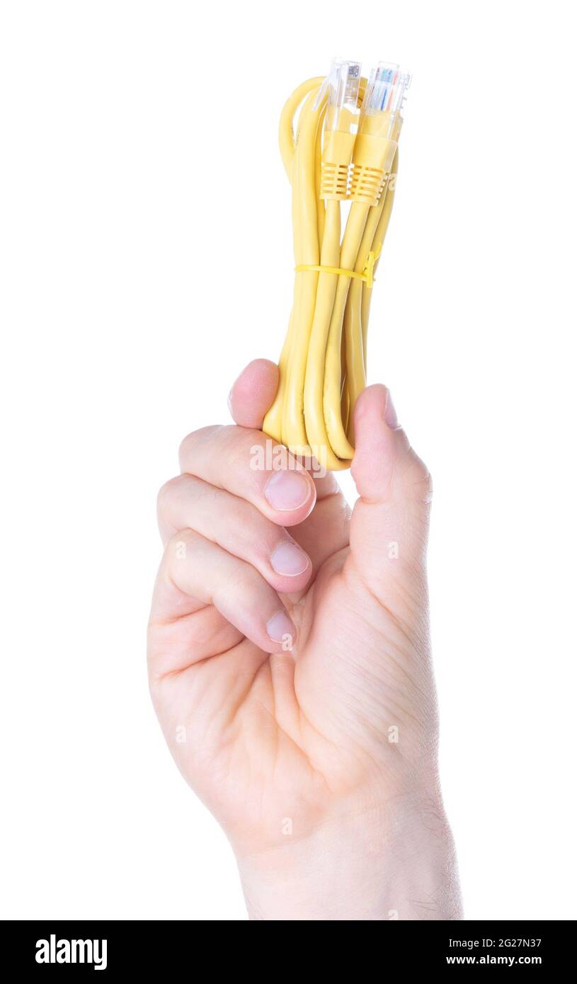Yellow UTP-cable in male hand, isolated on white Stock Photo - Alamy