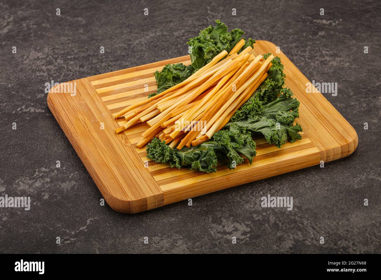 Caucasian Chechel cheese sticks over board Stock Photo - Alamy