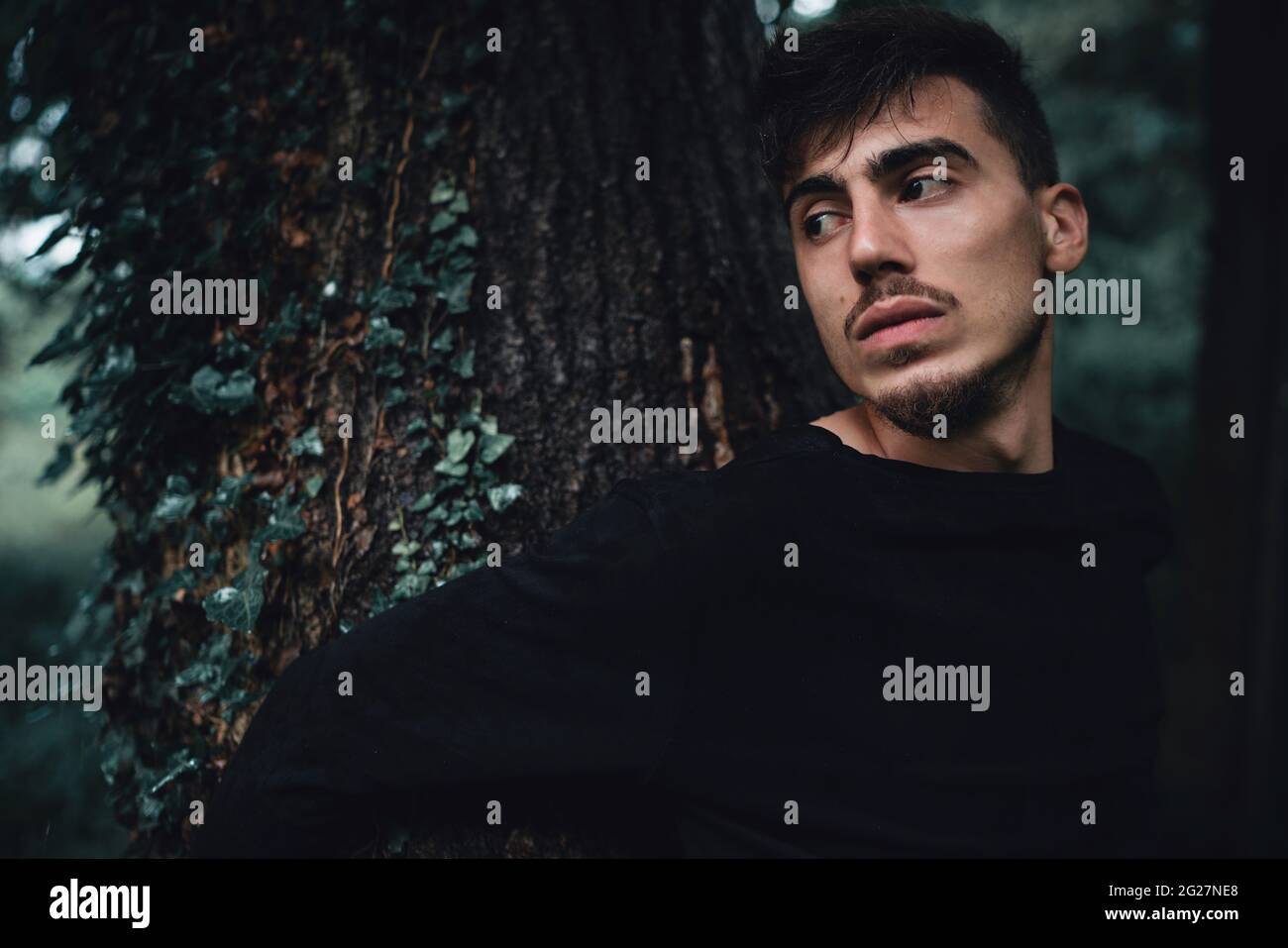 Young man protecting the forest trees, nature and people concept Stock ...