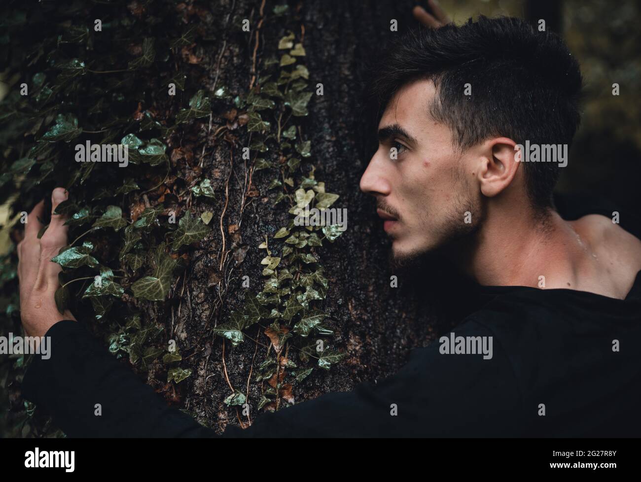 Young man protecting the forest trees, nature and people concept Stock ...
