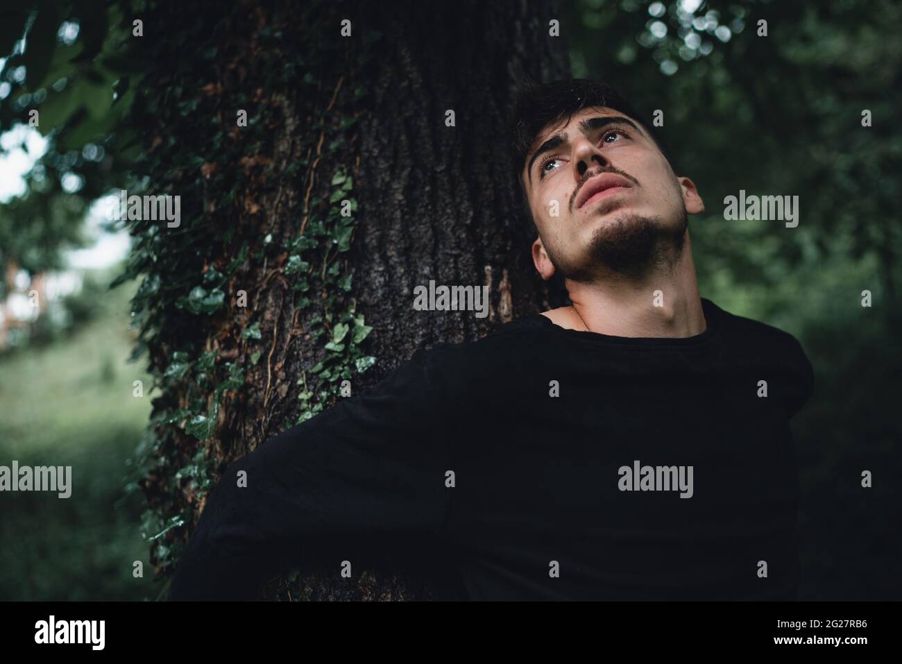 Young man protecting the forest trees, nature and people concept Stock ...