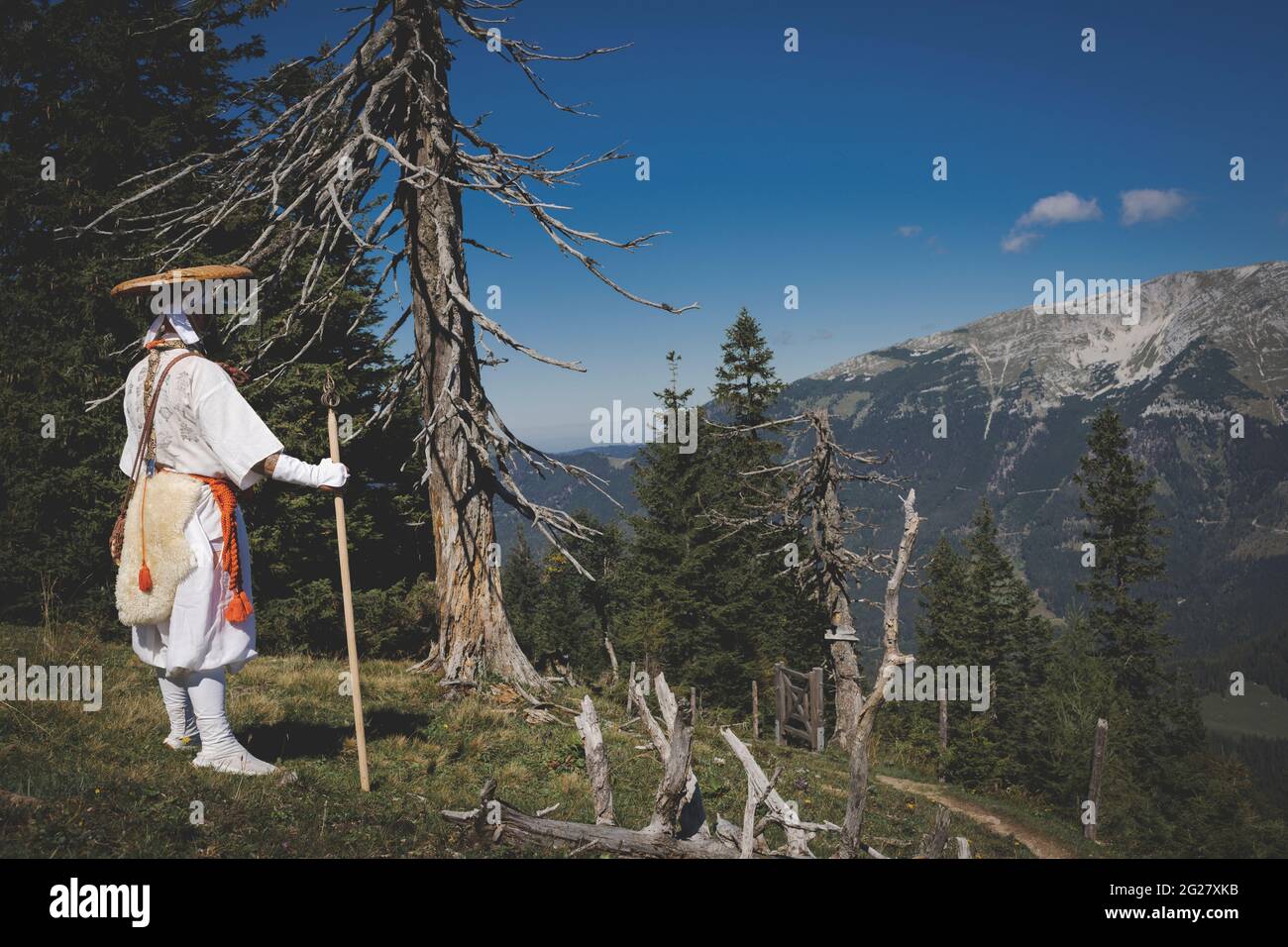 European Shugendo monk in traditional outfit hiking in the Austrian ...