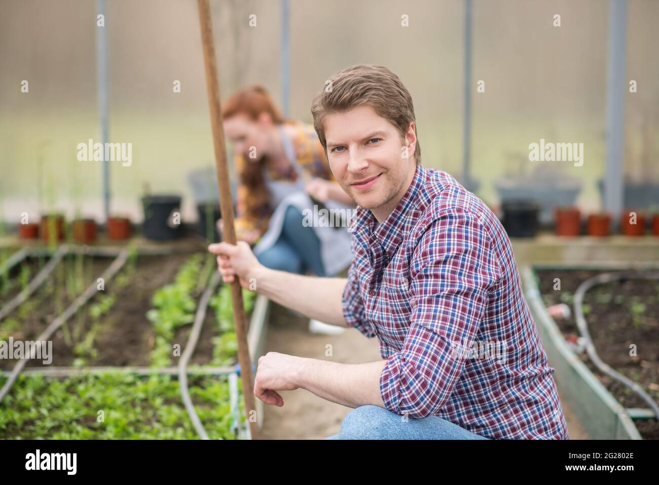 Man with rake hi-res stock photography and images - Alamy