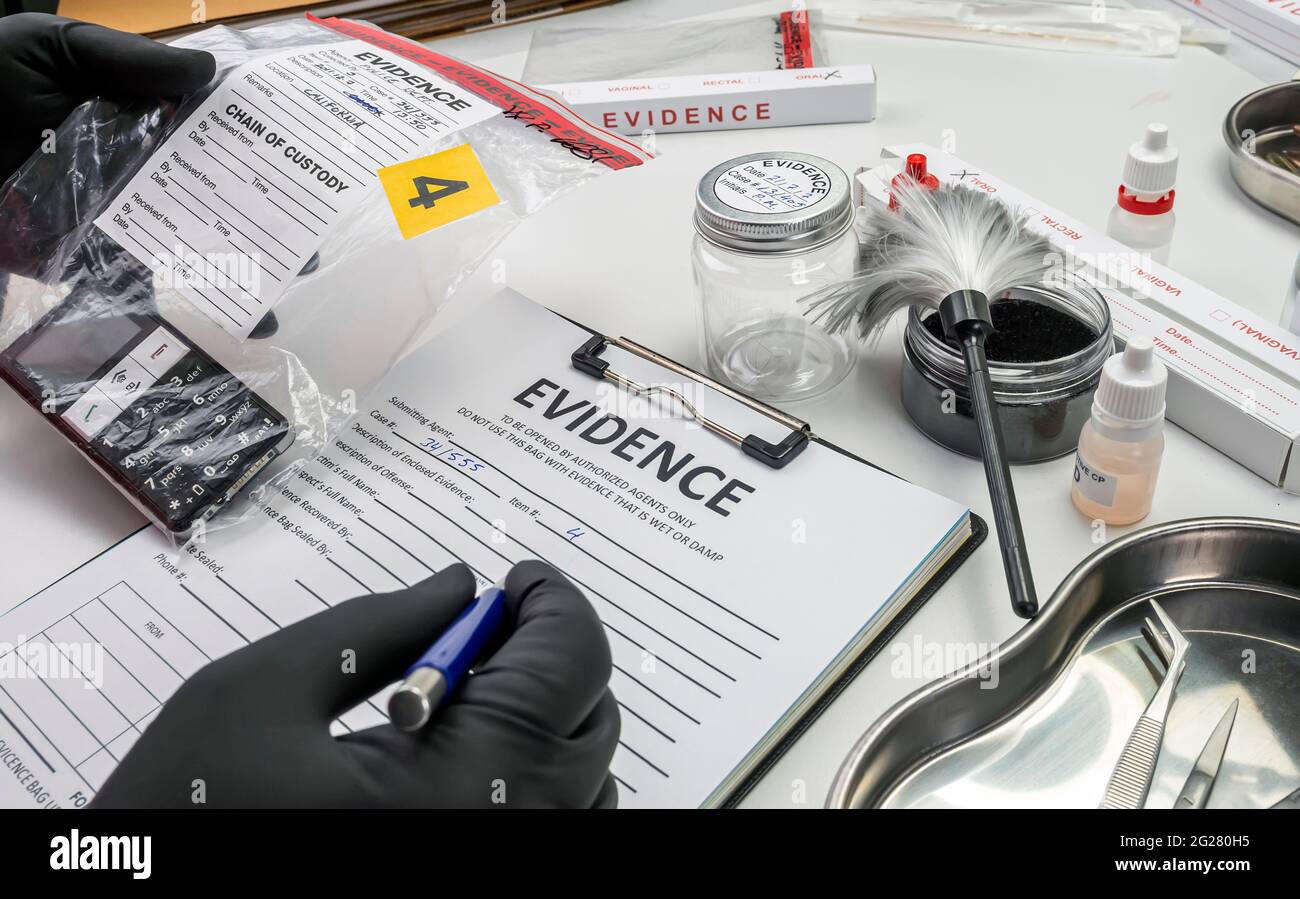 Forensic police take data from a phone involved in a homicide, crime ...