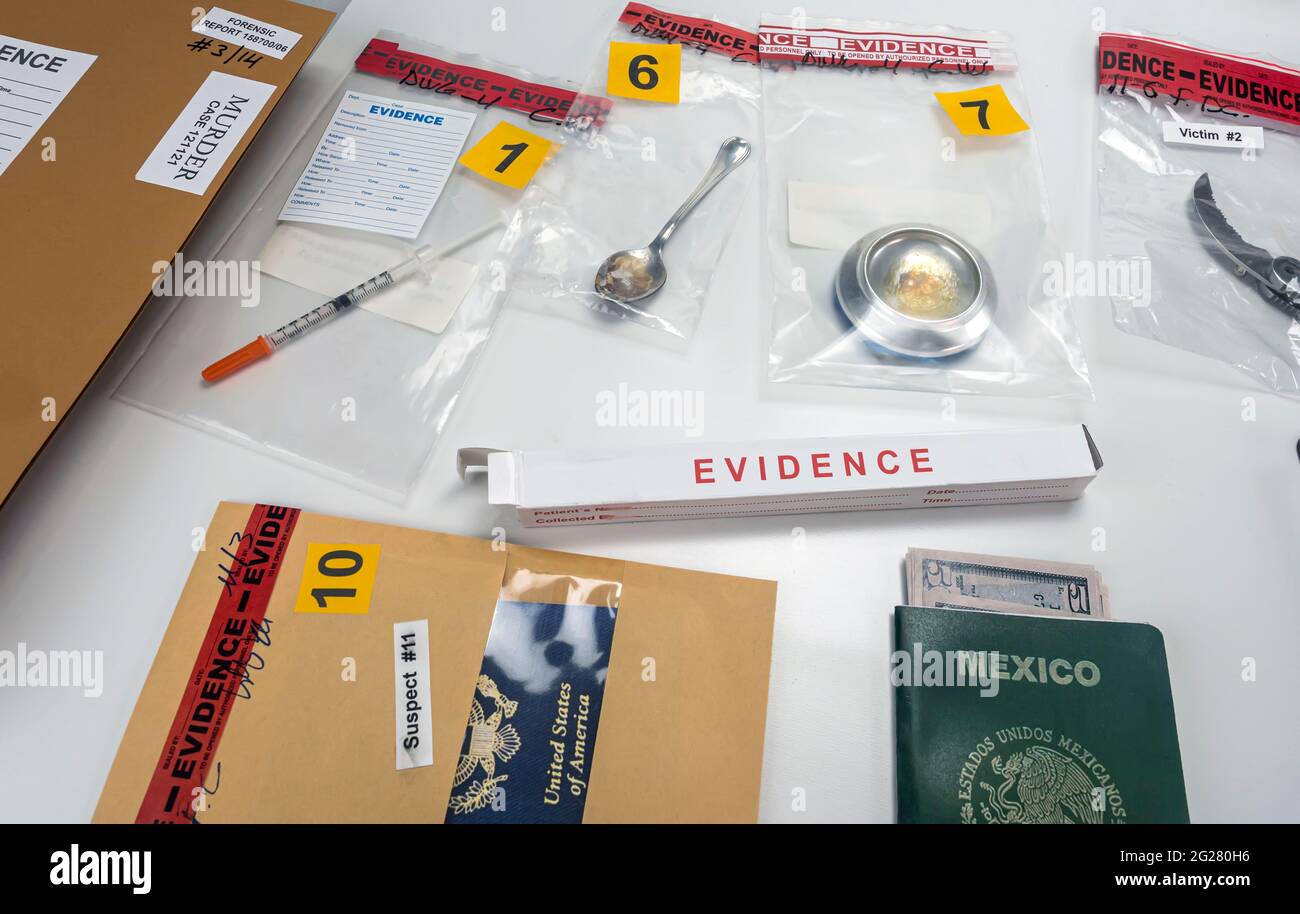 Syringe and spoon in police drug investigation department, concept ...