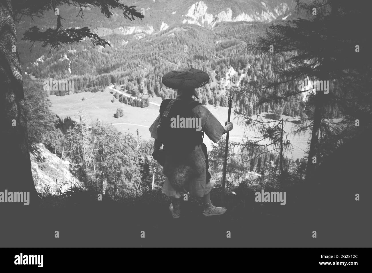 European Shugendo monk in traditional outfit hiking in the Austrian ...