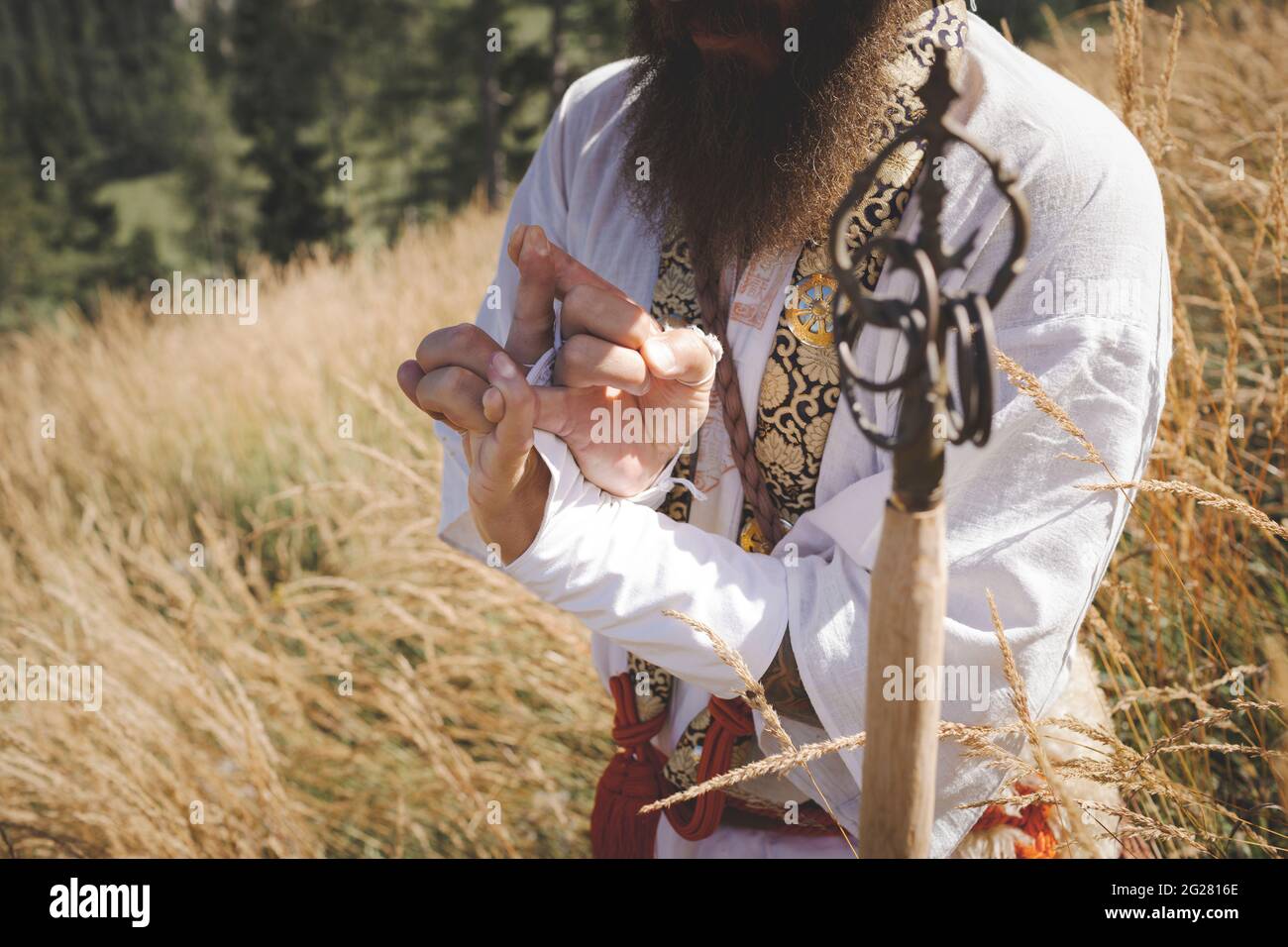 European Shugendo monk in traditional outfit hiking in the Austrian ...