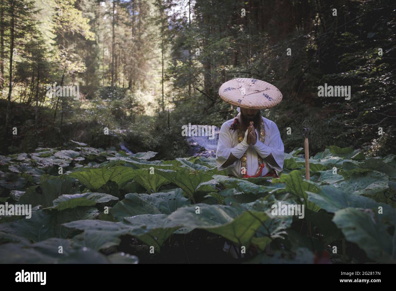 European Shugendo monk in traditional outfit hiking in the Austrian ...