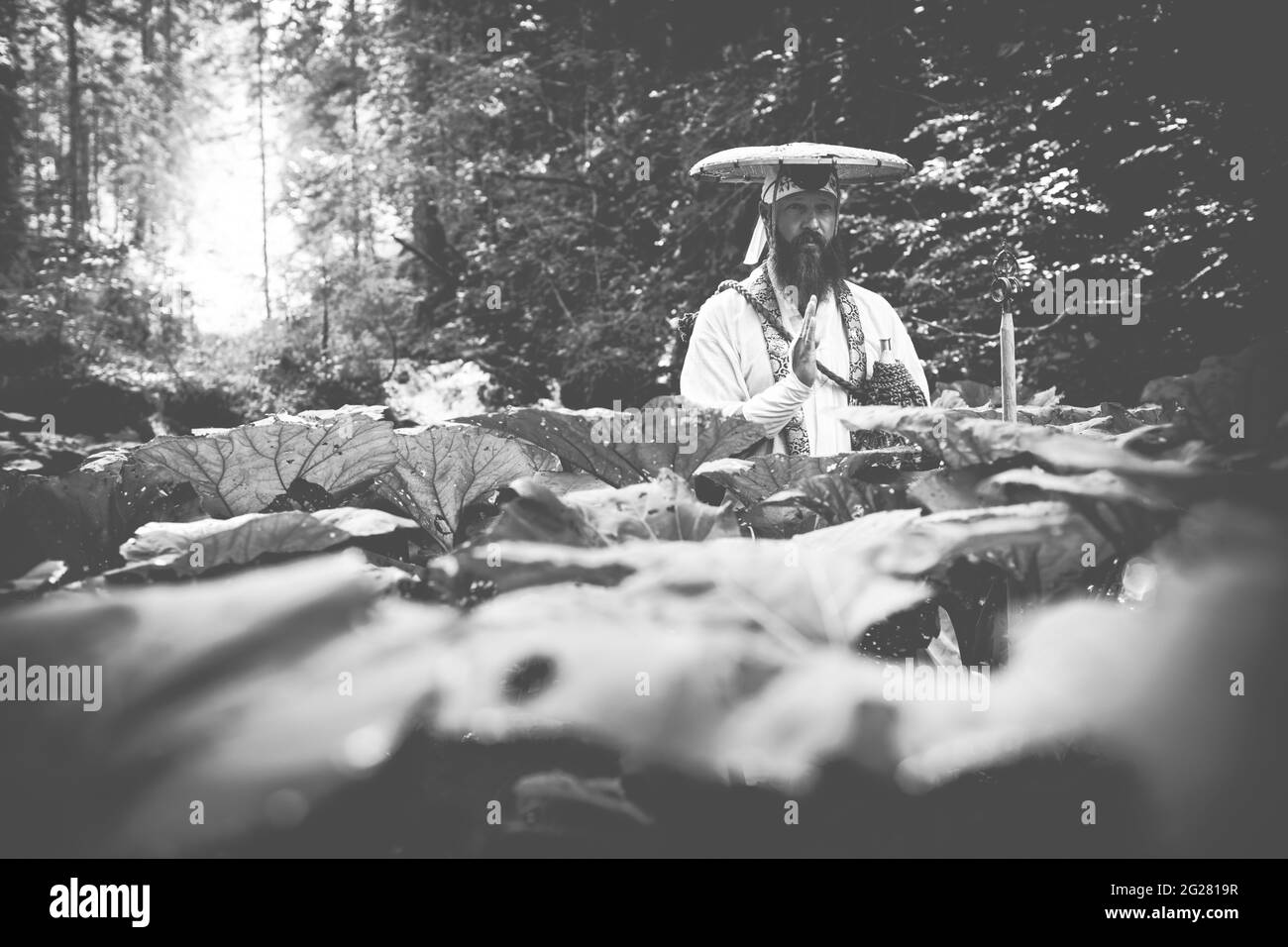 European Shugendo monk in traditional outfit hiking in the Austrian ...