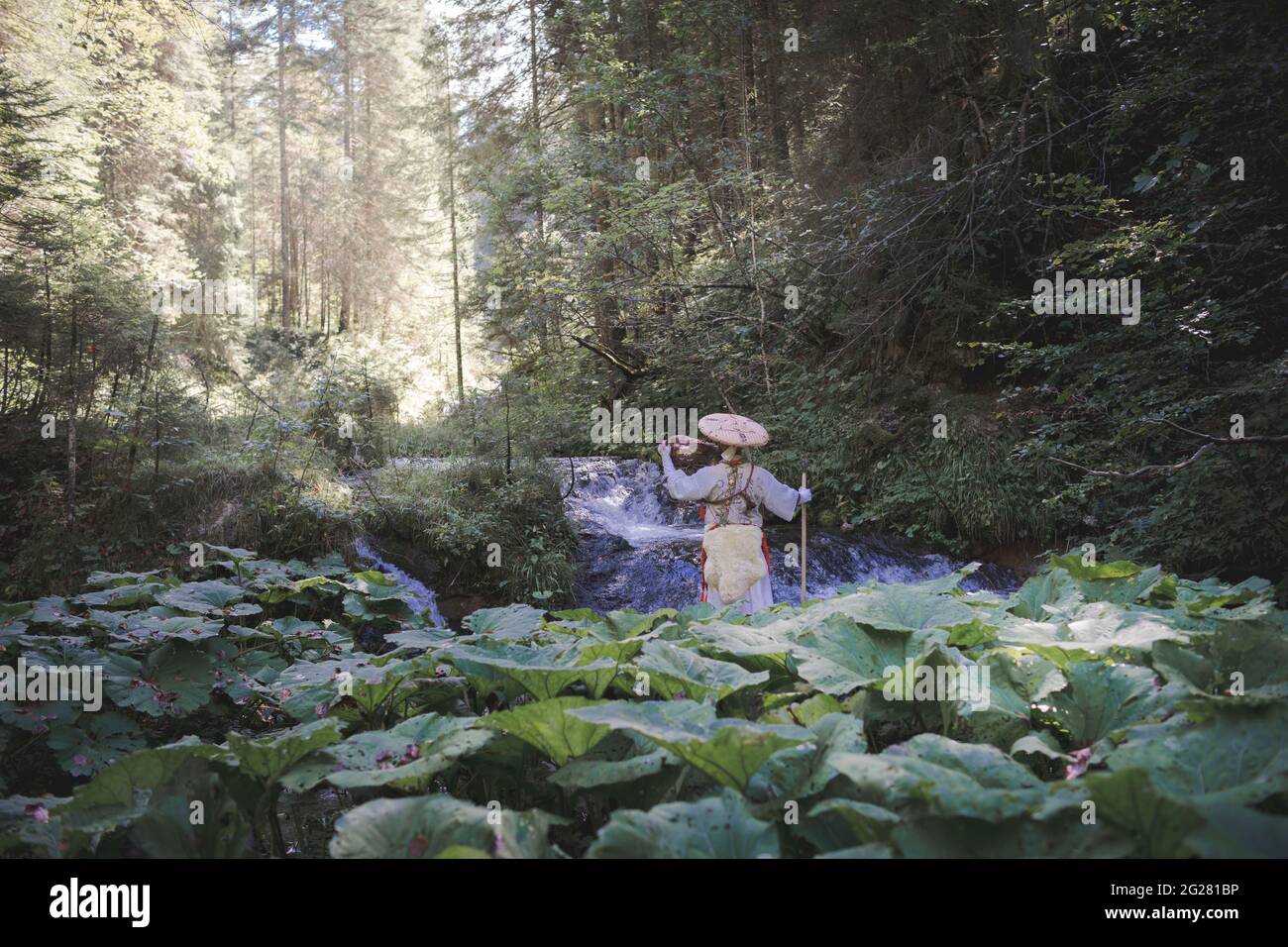 European Shugendo monk in traditional outfit hiking in the Austrian ...