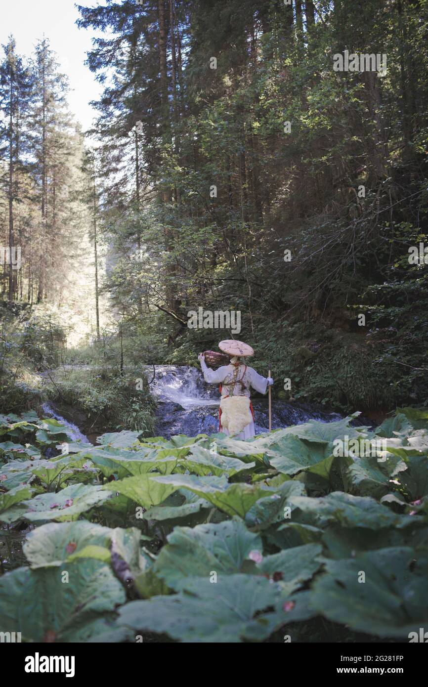 European Shugendo monk in traditional outfit hiking in the Austrian ...
