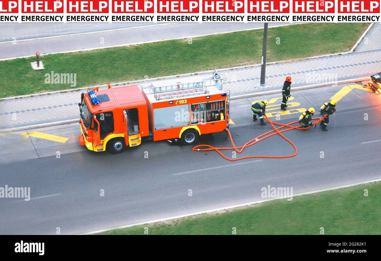 fire drill with four man who fight with the fire Stock Photo - Alamy