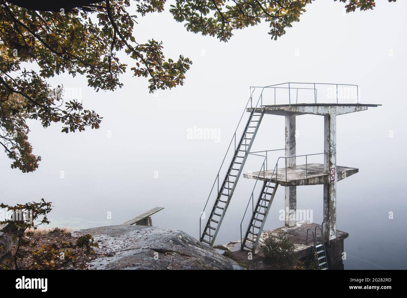 Diving tower at misty lake Stock Photo - Alamy