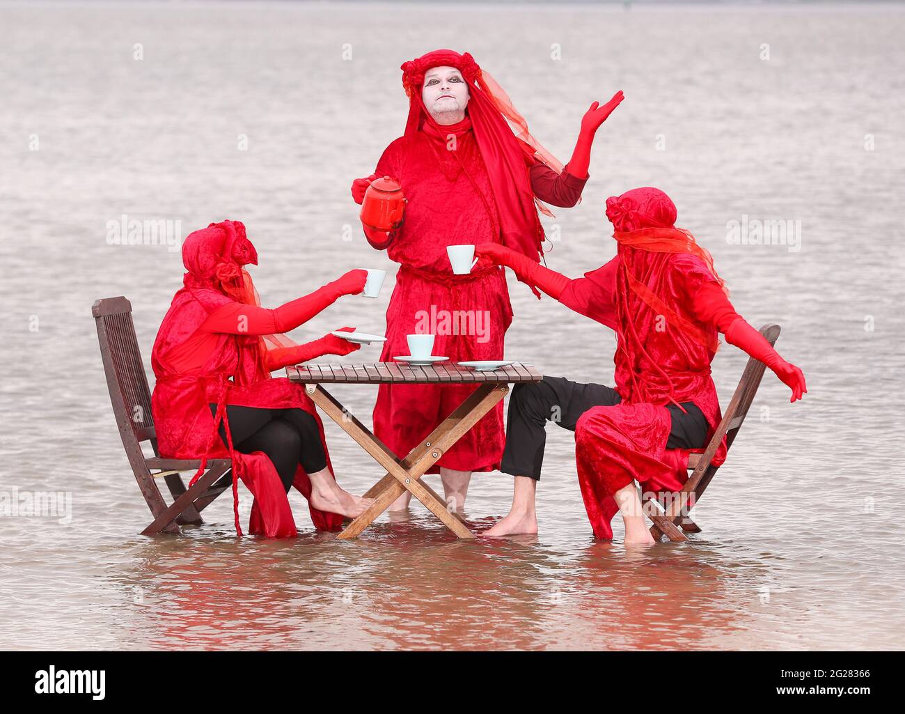 The Red Rebel Brigade hold a 'Tea in the Sea' protest in Belfast Lough ...