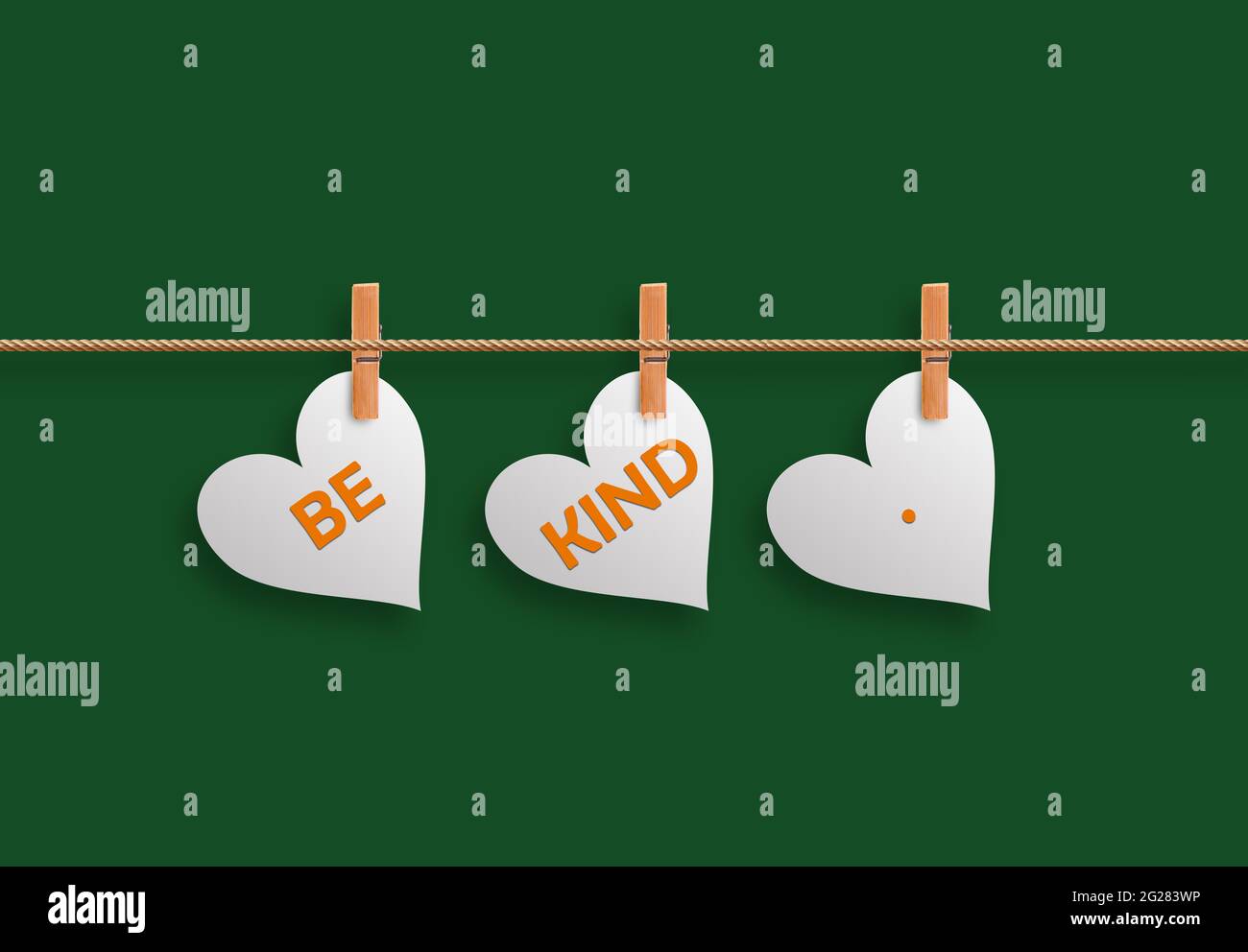 Motivational quote " BE KIND." Written in White Heart shape hanging in ...