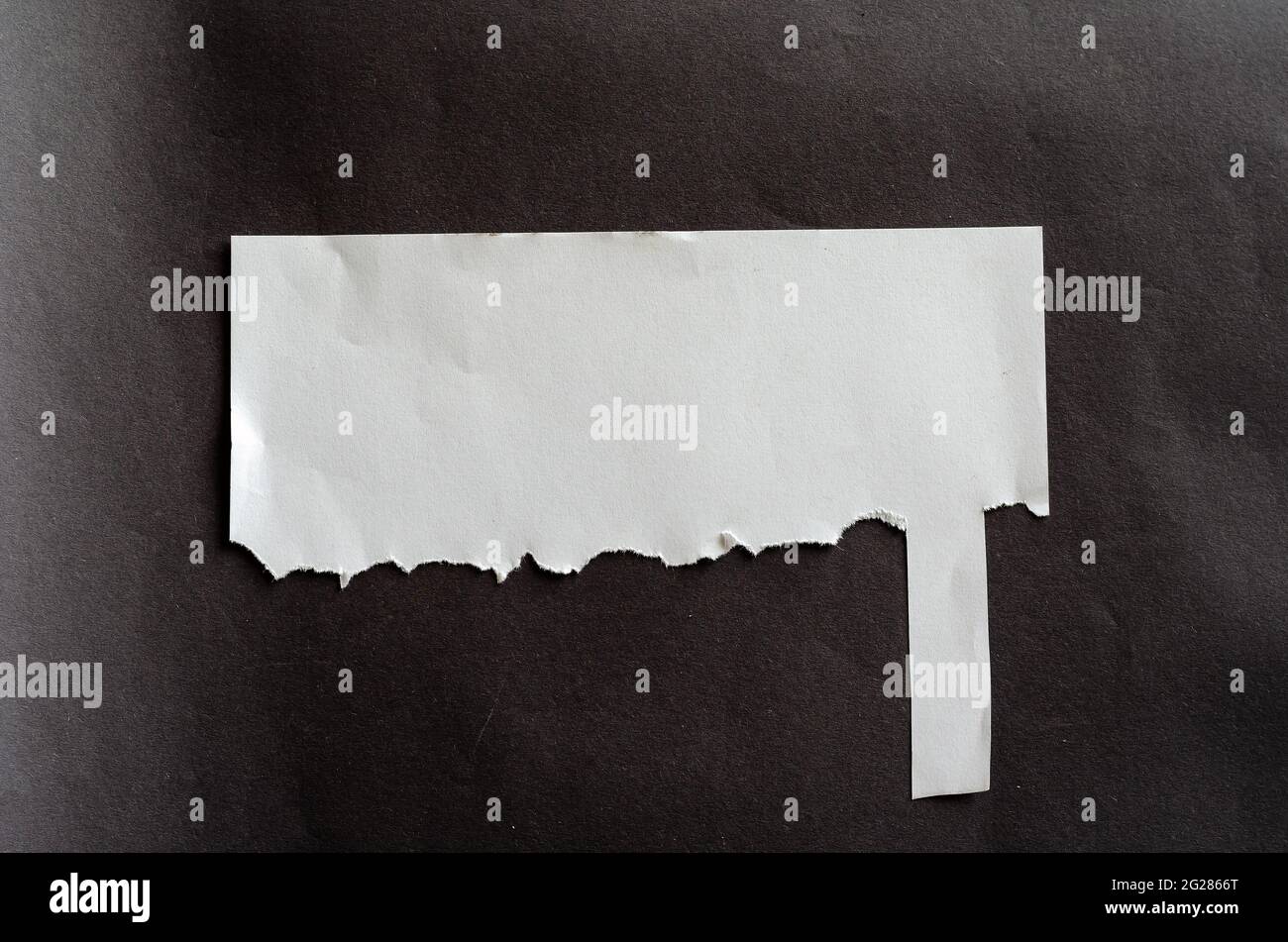 White blank sheet of paper with last tear off tab on gray background ...