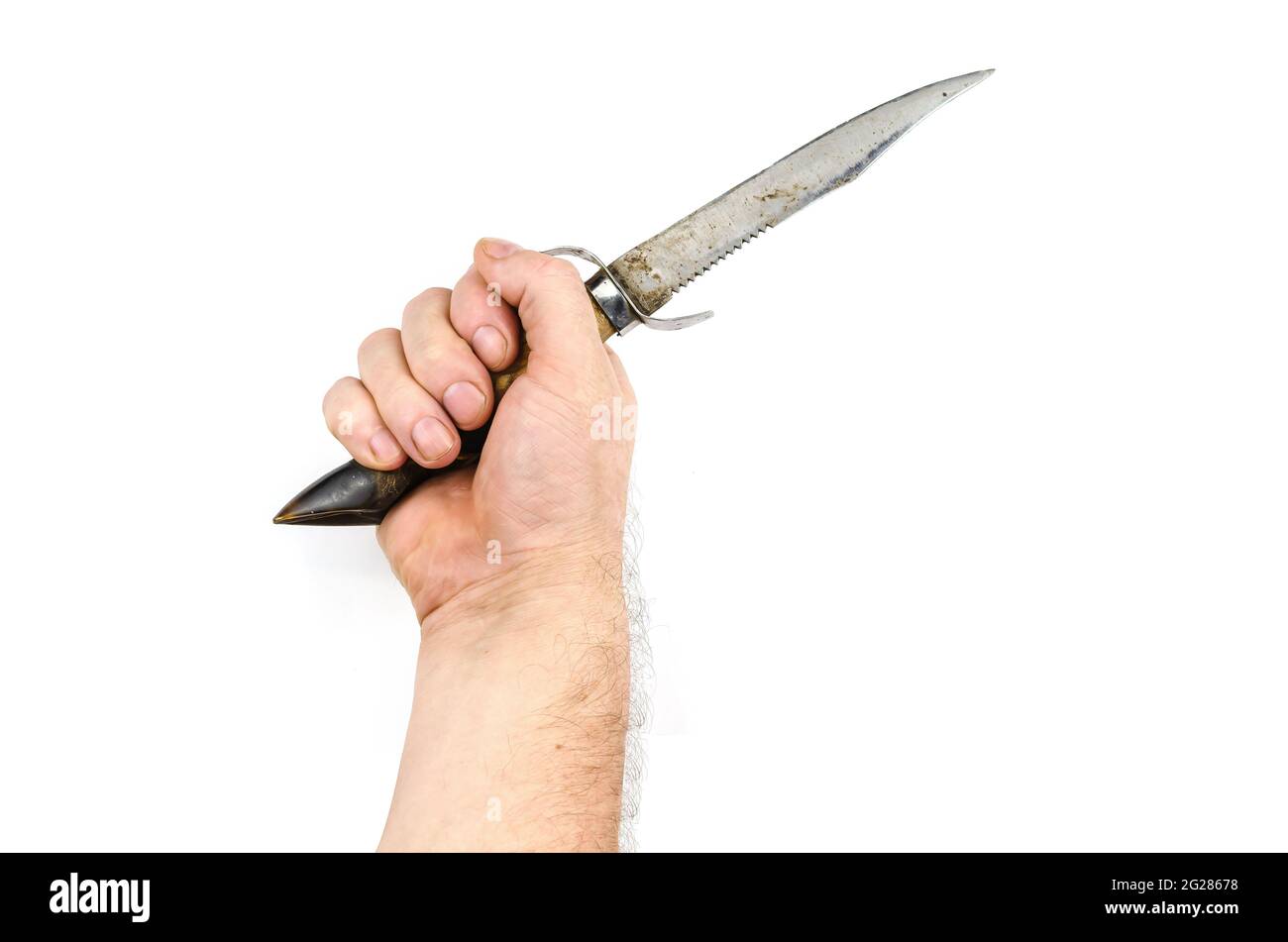 The handholds an old hunting knife made from a goat's hoof on the white ...