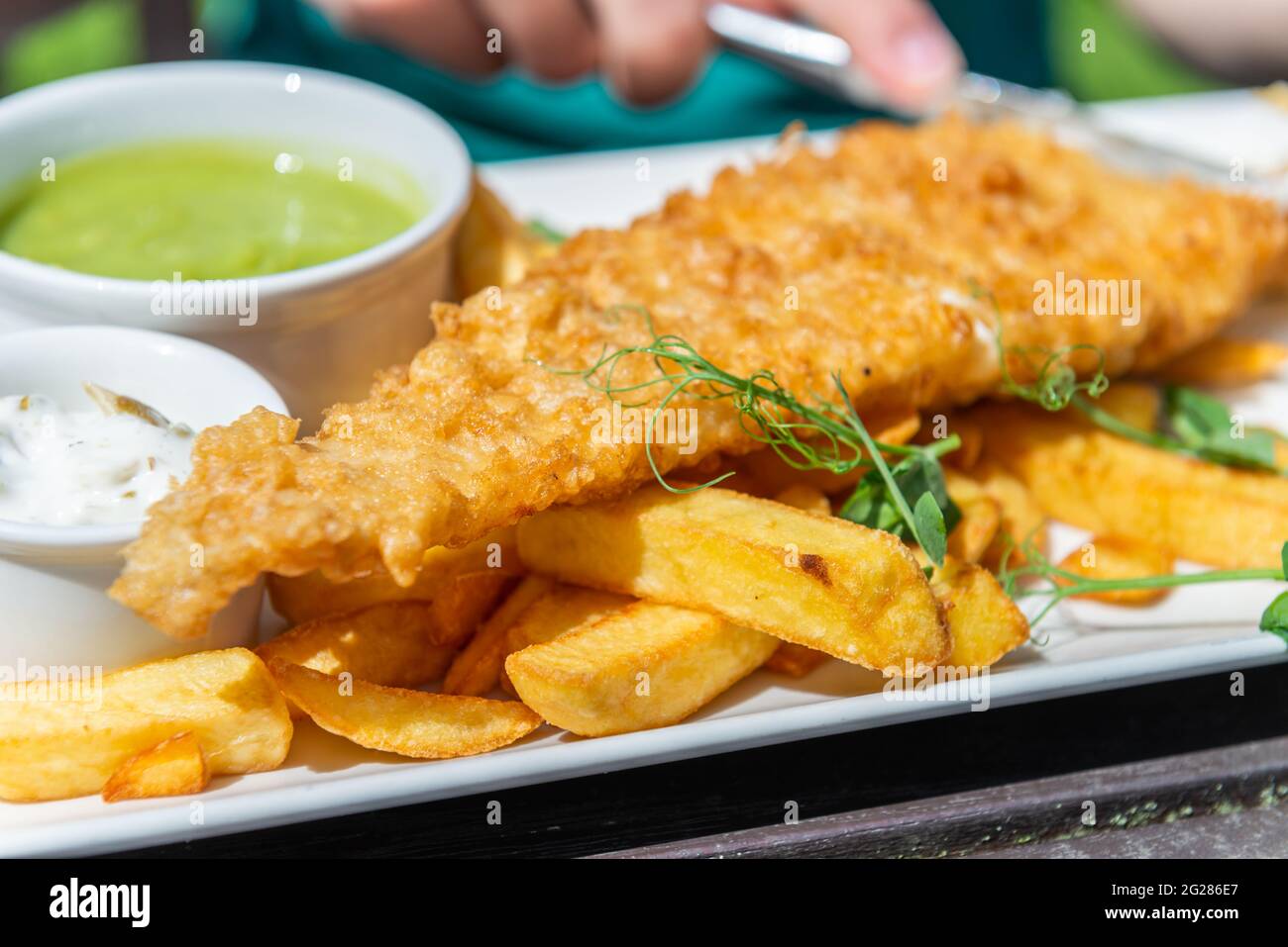 Fish and Chips with peas Stock Photo - Alamy
