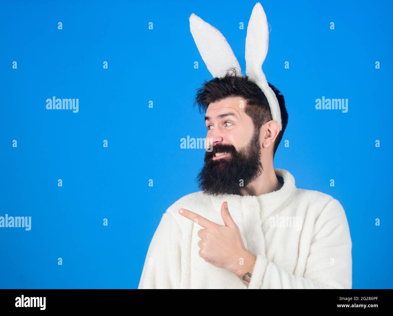 Man wearing bunny plush suit. Funny bunny man with beard and mustache ...