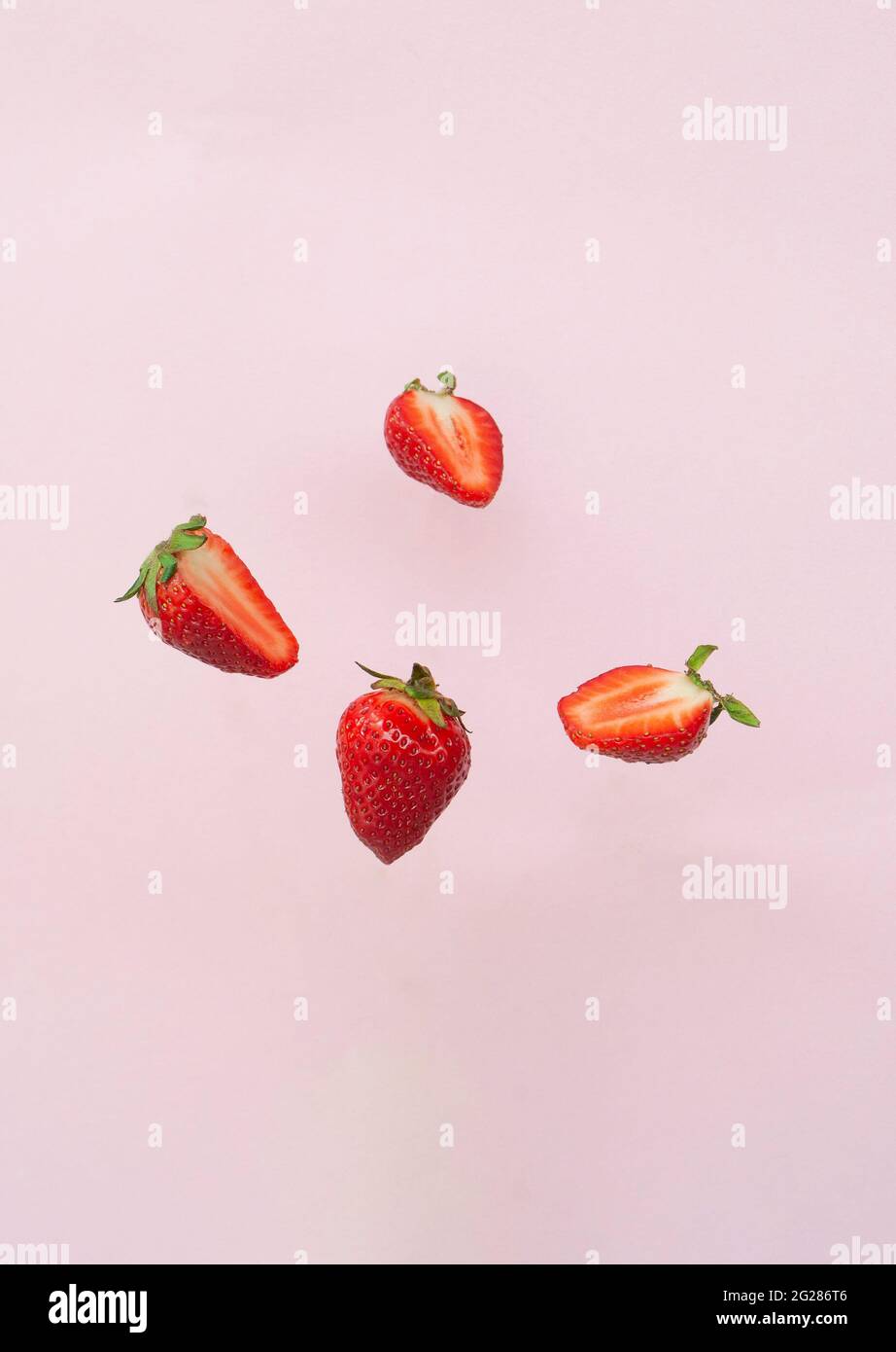 The composition of flying strawberries on pink background. Strawberry ... The composition of flying strawberries on pink background. Strawberry ...