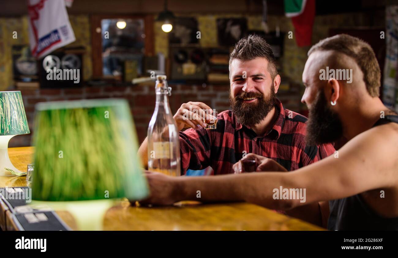 Friends relaxing in pub. Men drunk relaxing at pub having fun. Hipster ...