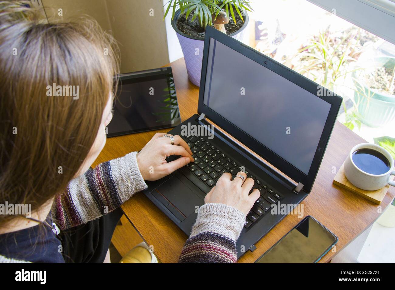 Working woman with notebook Stock Photo - Alamy