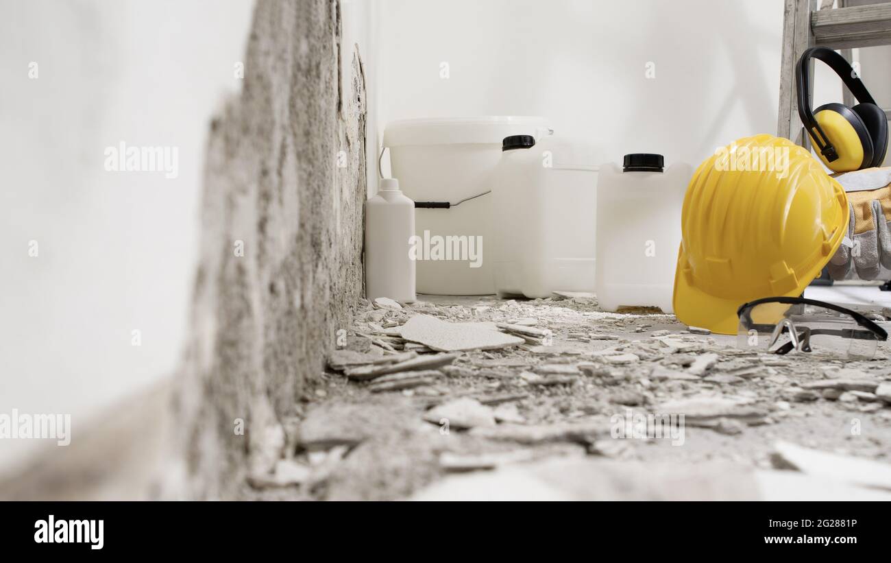 house renovation concept, wall in demolition with plaster rubble and ...