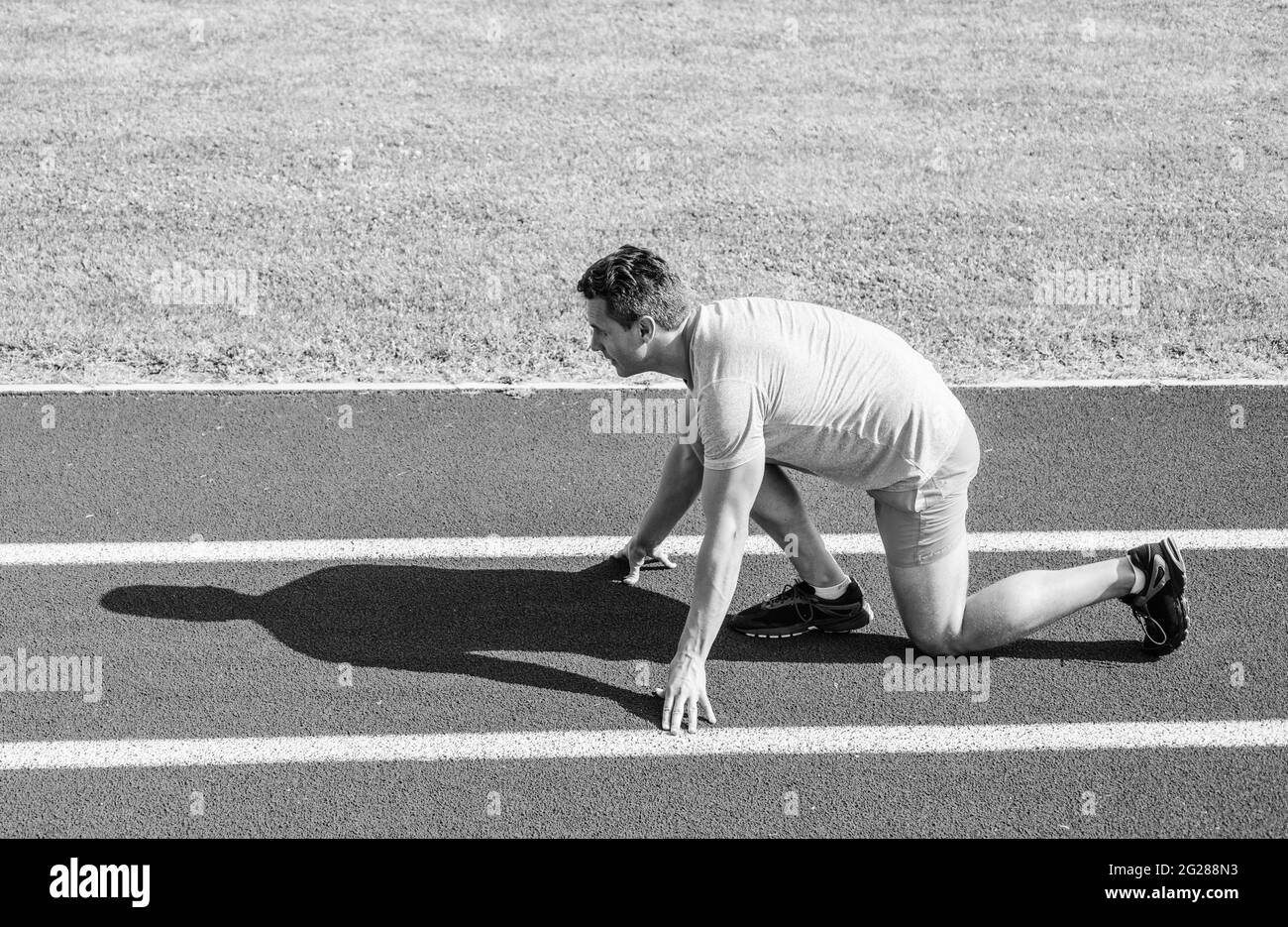 Adult runner prepare race at stadium. How to start running. Sport ...