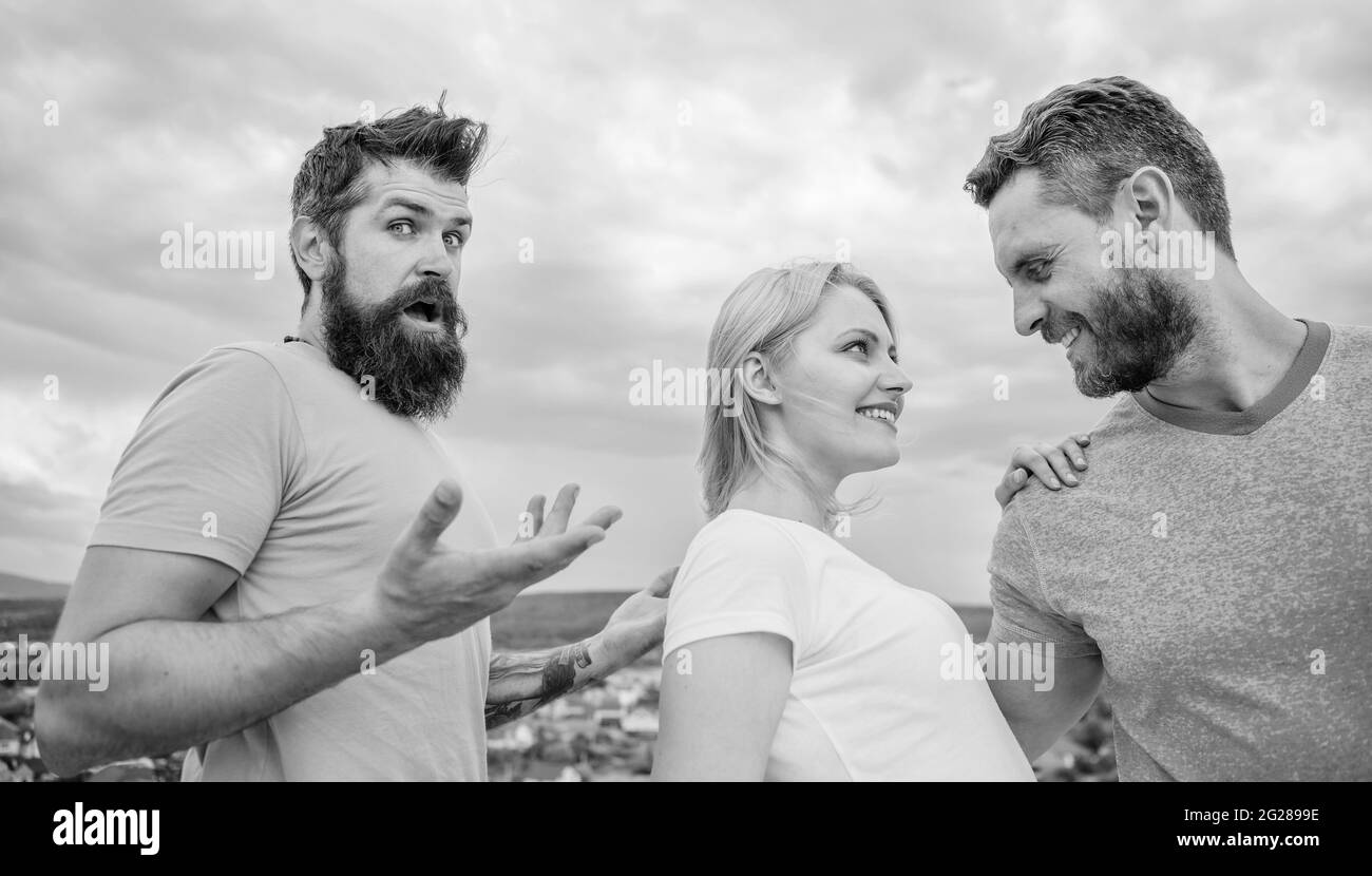 Girl stand between two men. Couple and rejected partner. Woman picked ...