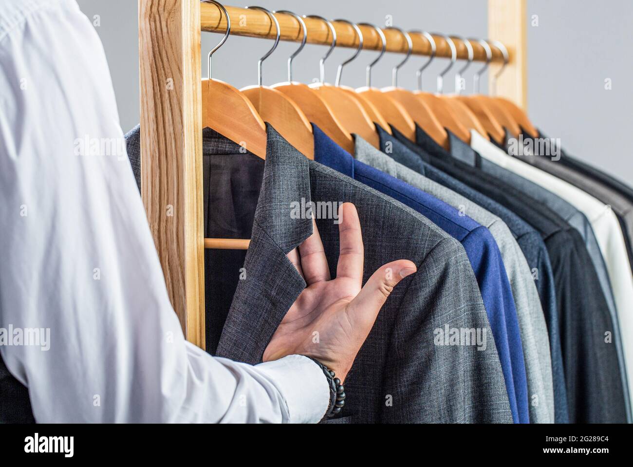 Suits hanging in closet hi-res stock photography and images - Alamy