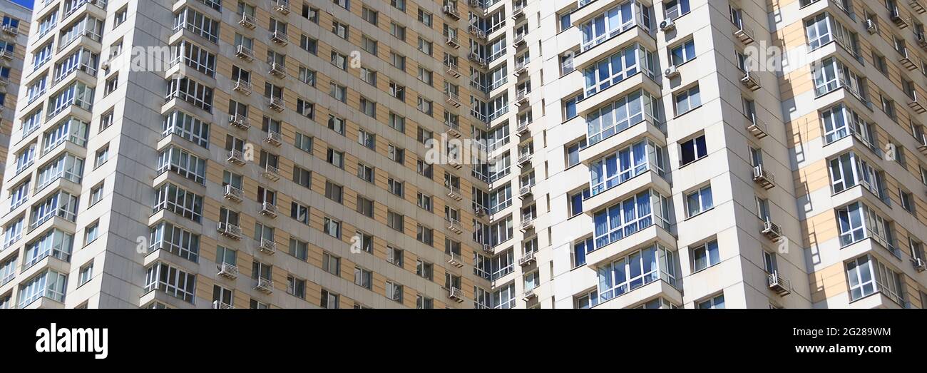 Facade of a high-rise apartment building. Typical city development ...