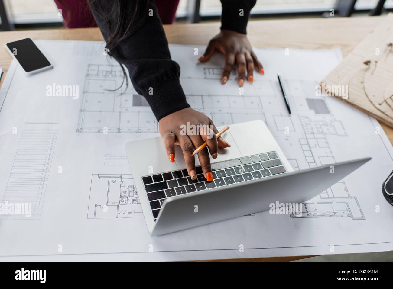 Female engineer using laptop near hi-res stock photography and images ...