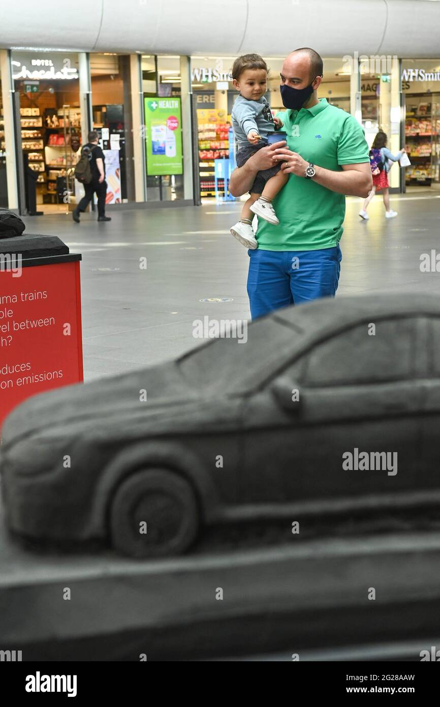 EDITORIAL USE ONLY Raph, aged 2, and his father look at a series of ...