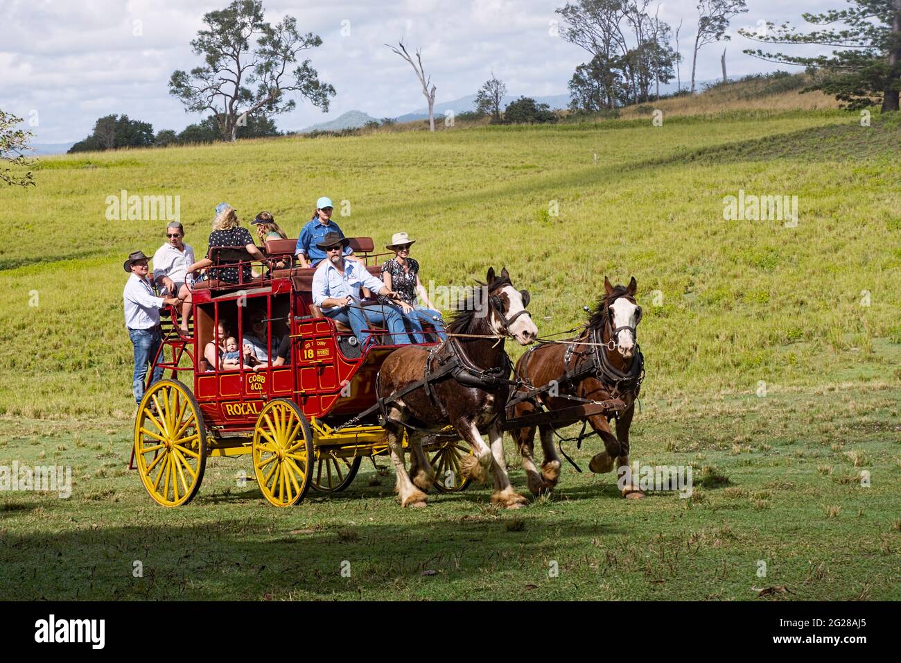 Passengers being taken for a joyride in old vintage Cobb and Co coach ...