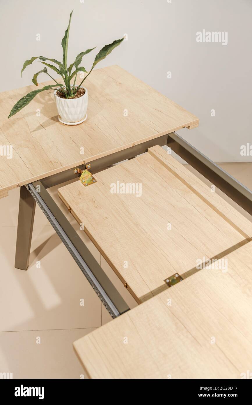 Extendable dinning table. Slide gear close up view Stock Photo - Alamy